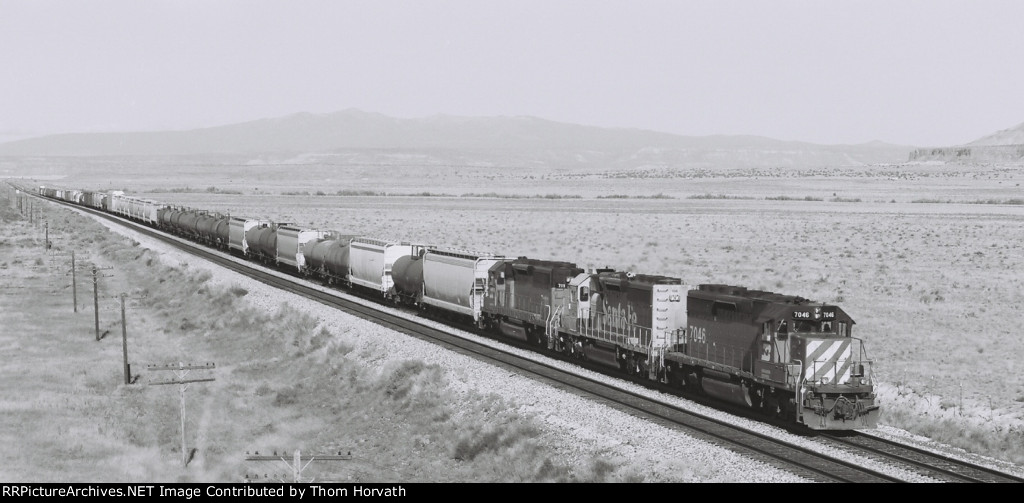 BN 7046 leads a mixed merchandise freight on the wide open range